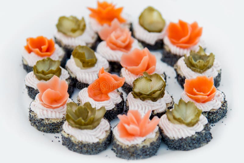 Close Up of Small Sweet Canapes Arranged on a Mirror Plate Over Light ...