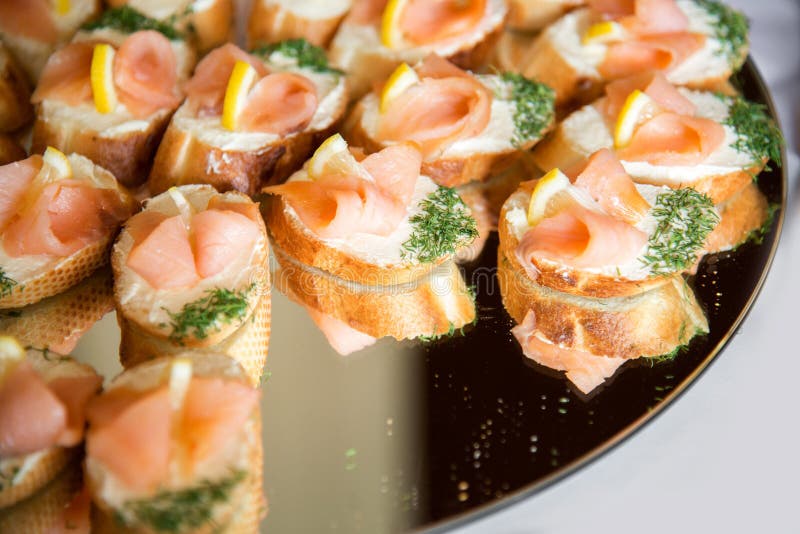 Close Up of Small Canapes Arranged on a Plate Over Light Background ...