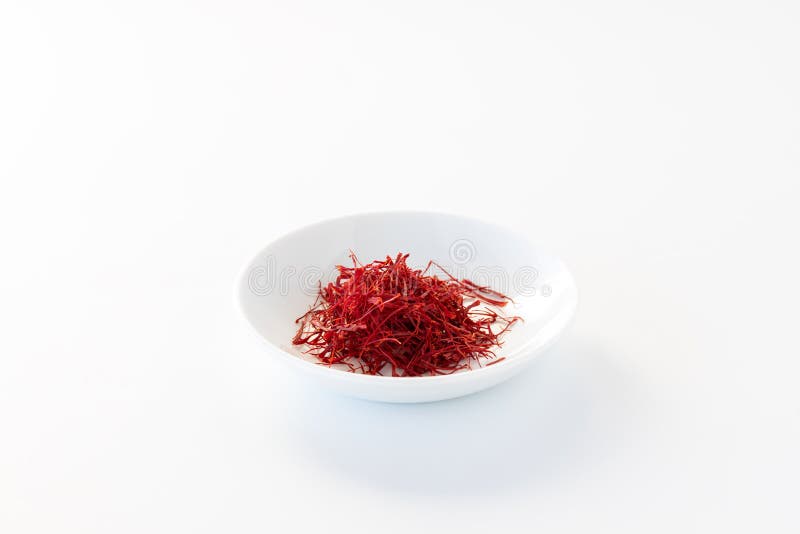 Close Up of a Small Dish Filled with Saffron Threads Against a White ...