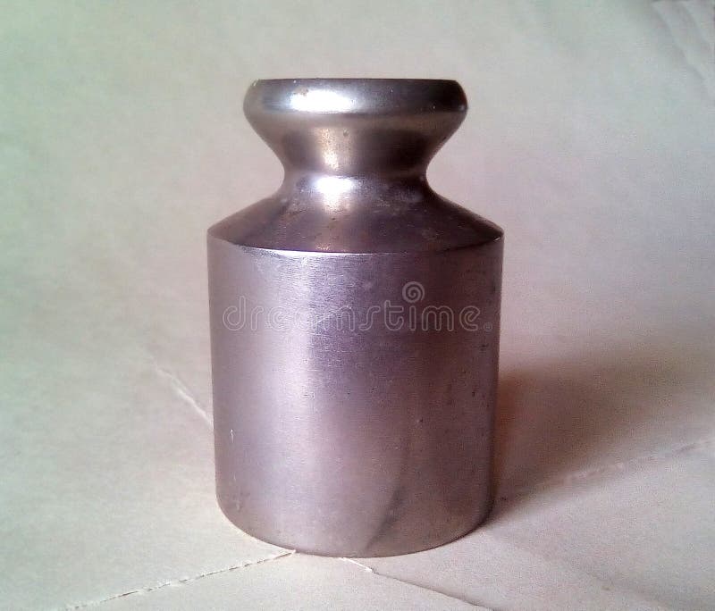Close-up of a Small Metal Weight for Scales. Light Silver Metal on a ...