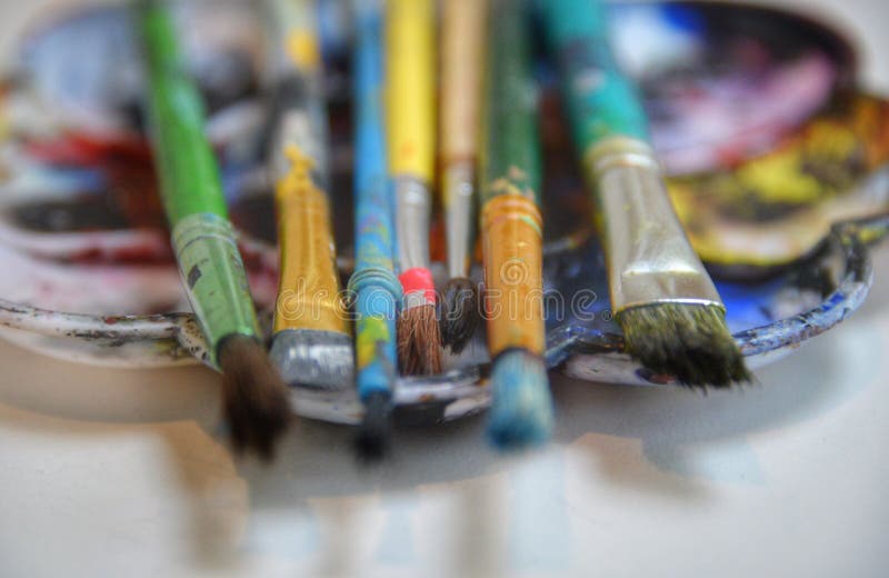 Close Up of a Small Paint Palette with Several Artist Brushes on Top ...