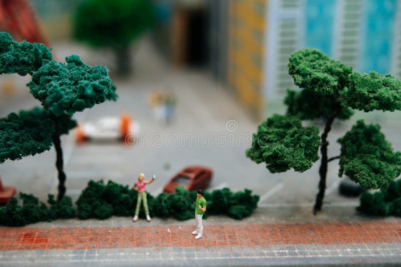 Close Up of Small People or Model People Walking in the Park Stock ...