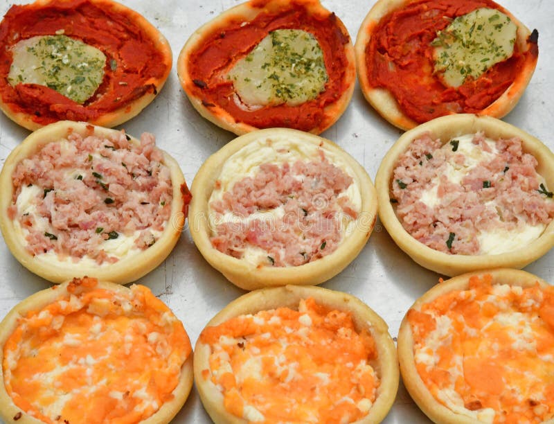A close up of small pizzas stock image. Image of cheese - 174697243