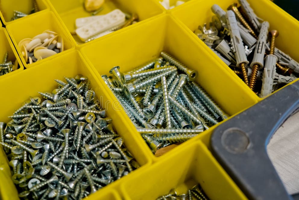 Close-up of Small Plastic Yellow Boxes with Different Screws and ...