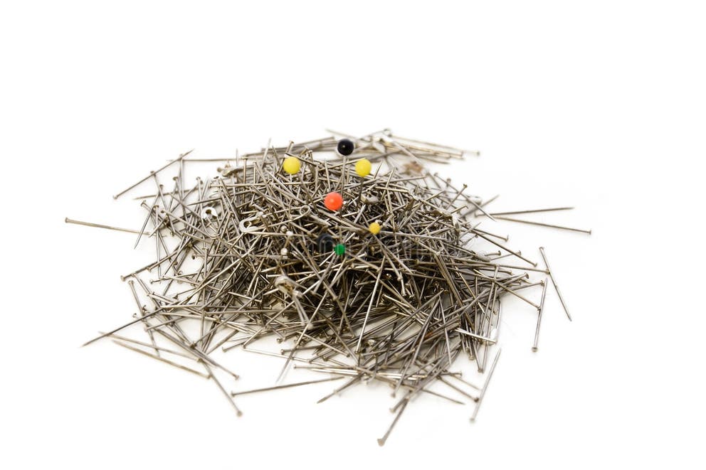 Close-up of a Small Stack of Pins and Needles on a White Background ...