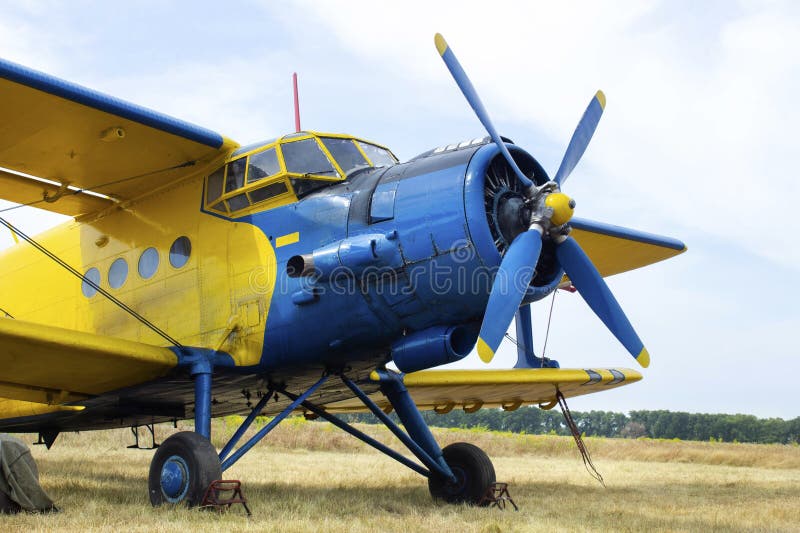 Close-up of a Small Yellow-blue Plane Standing in a Field. Old ...