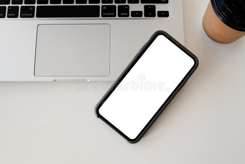 Close Up Smart Phone and Computer on White Table Top View. White Screen ...