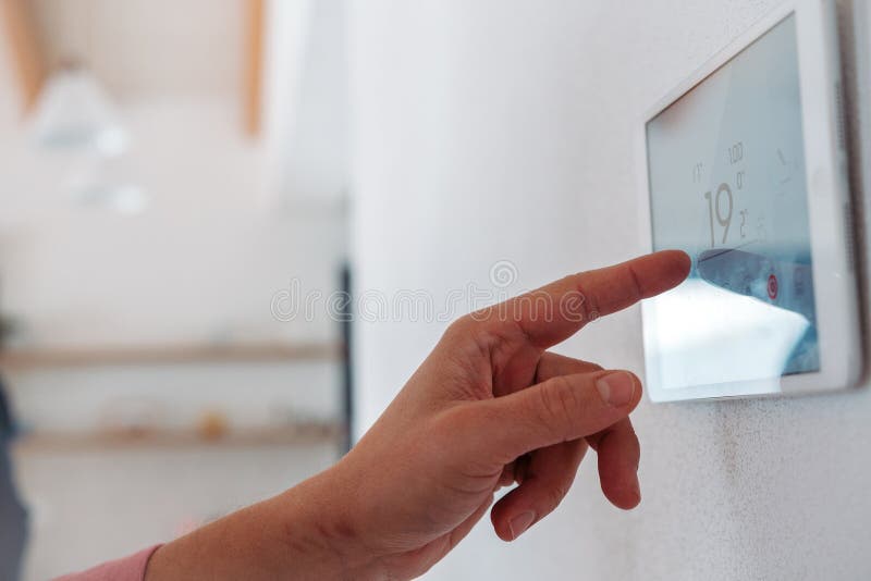 Close Up of Smart Thermostat, Adjusting, Lowering Heating Temperature ...