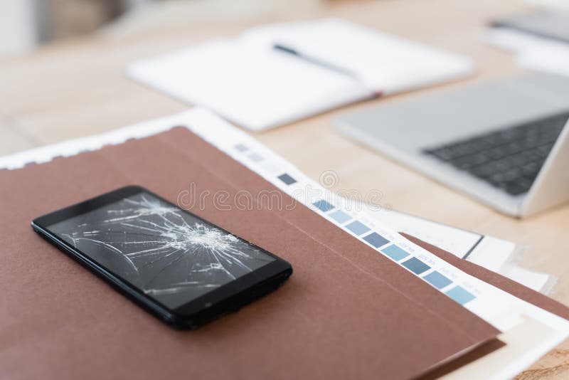 Smashed Smartphone is Burning on a Table Stock Photo - Image of crashed ...
