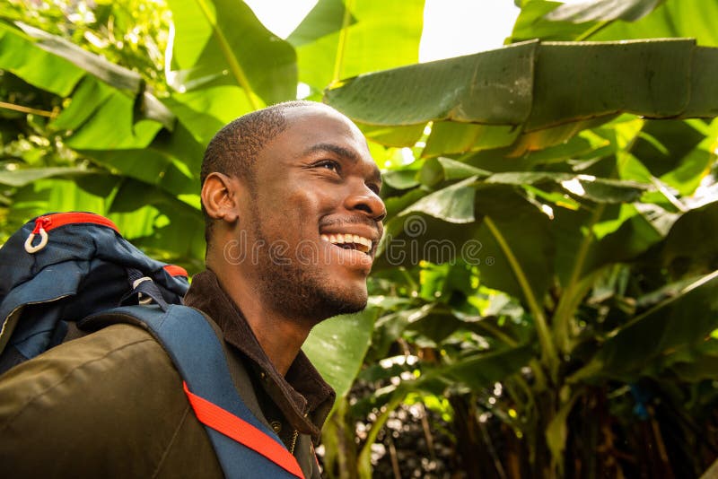 Close Up Smiling African American Backpacker Standing by Trees Stock ...