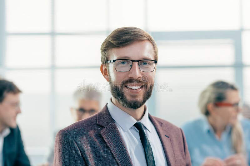 Close Up. Smiling Business Man Standing in the Office Stock Image ... Close Up. Smiling Business Man Standing in the Office Stock Image ...