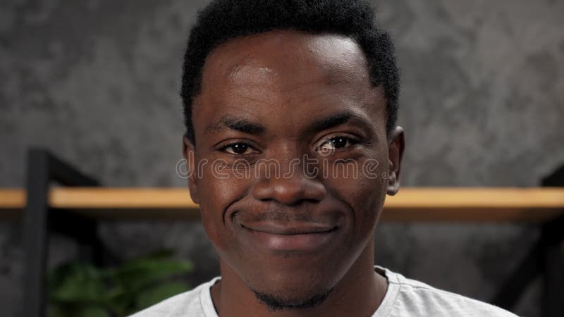 Close Up Smiling Face African American Man Looking Camera, Standing in ... Close Up Smiling Face African American Man Looking Camera, Standing in ...