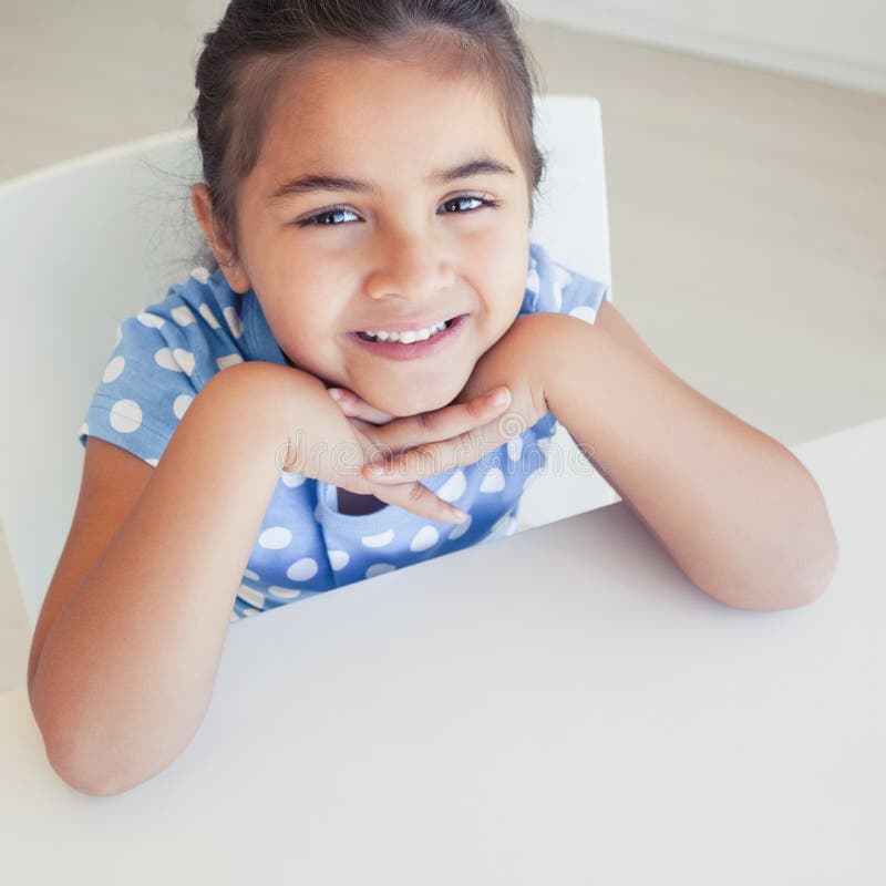 Close-up of a Smiling Girl at Table Stock Photo - Image of childhood ...