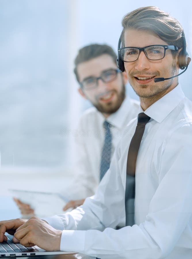 Close Up.smiling Operator, Sitting at His Desk Stock Photo - Image of ...