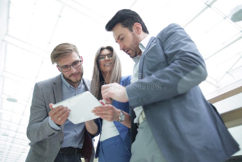 Close Up.smiling Staff Looking at the Digital Tablet Stock Image ...