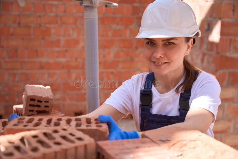 Close-up Smiling Woman Building Engineer Sorting Bricks on Construction ...