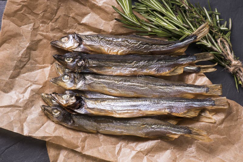 Close Up. Smoked Fish Capelin Wrapped in Kitchen Paper Stock Photo ...