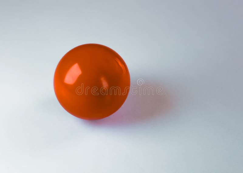 Close-up of a Red Smooth Solid Shiny Ball Isolated on a White ...