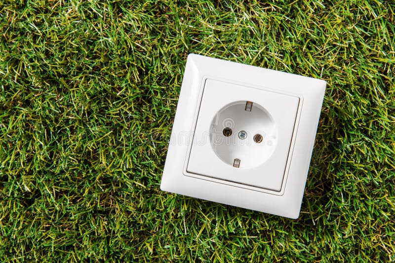 Close Up of Socket and Plug on Green Grass Stock Photo - Image of ...