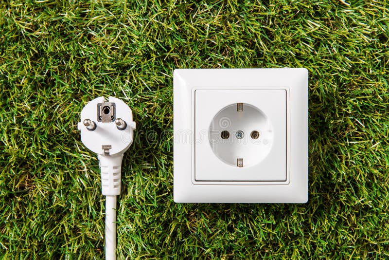 Close Up of Socket and Plug on Green Grass Stock Photo - Image of gang ...