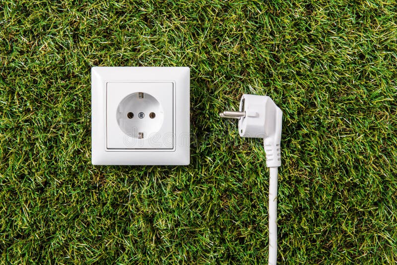 Close Up of Socket and Plug on Green Grass Stock Photo - Image of ...