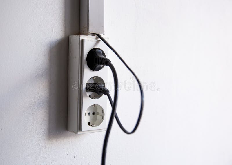 Close Up of a Socket and Plugs on White Wall Stock Image - Image of ...