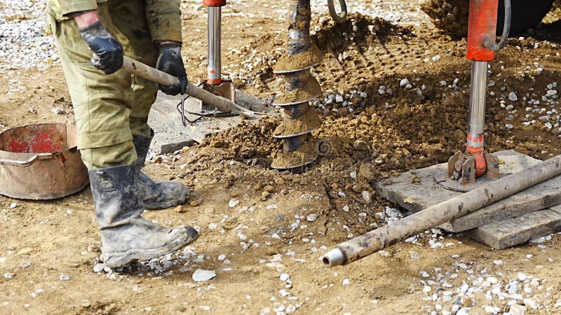 Close-up of Soil Sampling during Pile Drilling Process. Extraction of ...