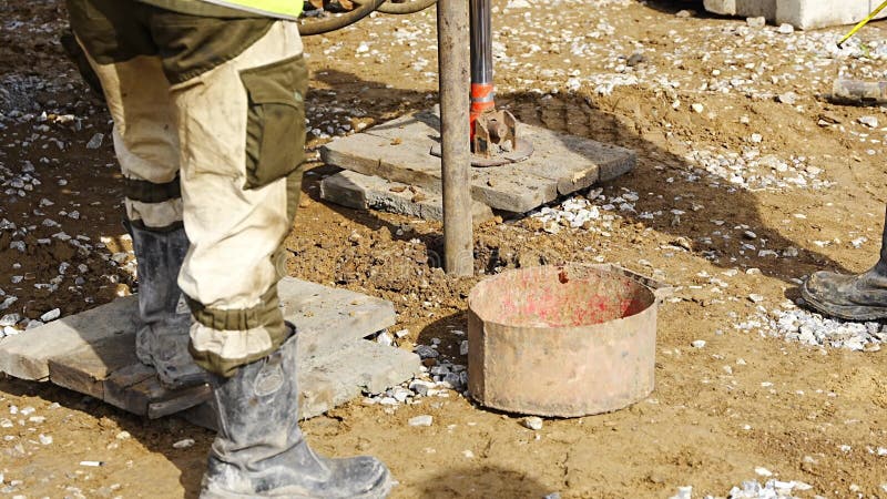 Close-up of Soil Sampling during Pile Drilling Process. Extraction of ...
