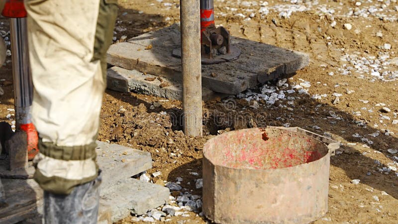 Close-up of Soil Sampling during Pile Drilling Process. Extraction of ...