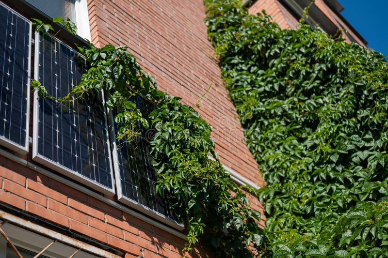 Close-up of Solar Panels on a Red Brick Wall. Alternative Energy Source ...