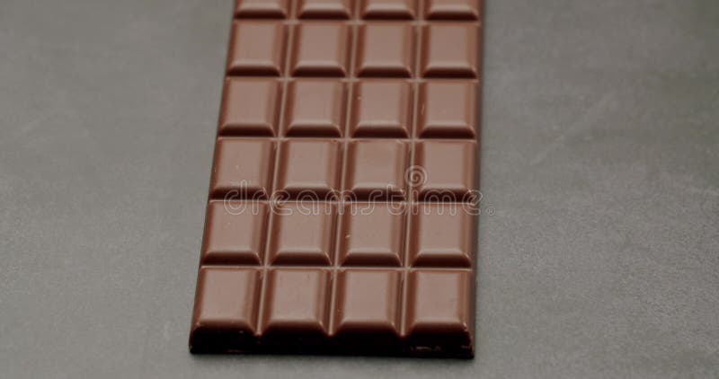 Close-Up of Solid Chocolate Bar on Dark Background in Simple Design ...