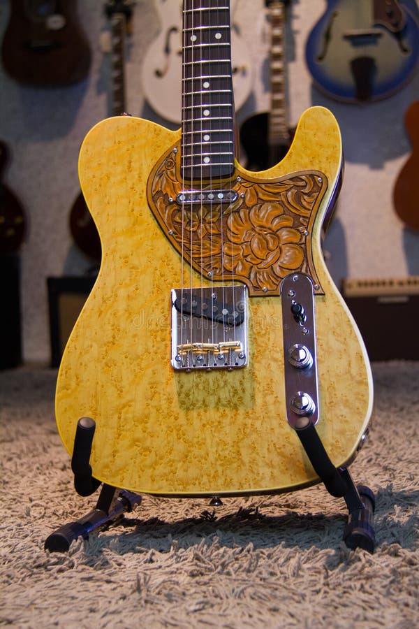 Close Up of a Solid Natural Brown Electric Guitar with Leather ...
