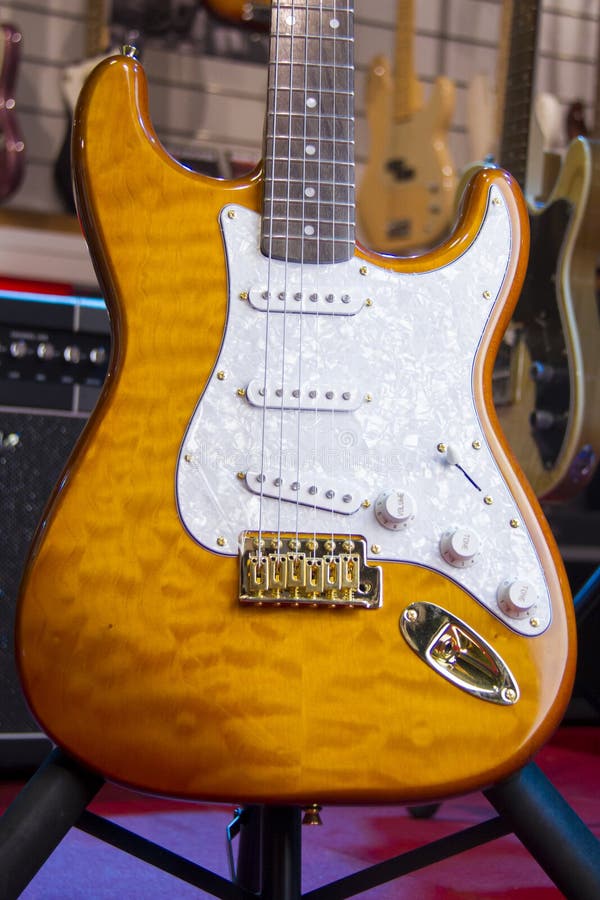Close Up of a Solid Orange Electric Guitar Stock Photo - Image of close ...