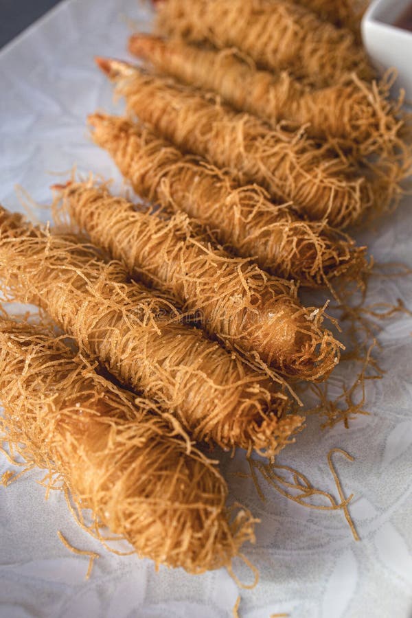 Close-up of Some Prawns Wrapped in Small Spirals of Crispy Potato ...