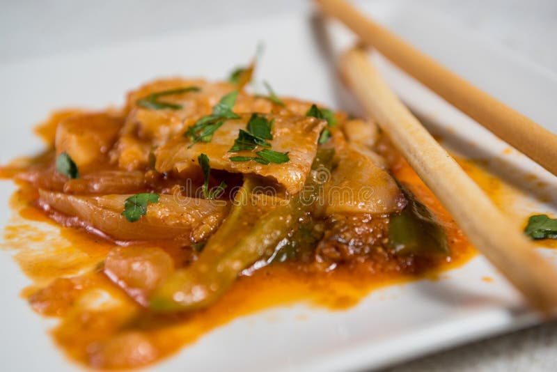 Close Up Spanish Tapa of Fish with Orange Sauce and Bread Sticks Stock ...