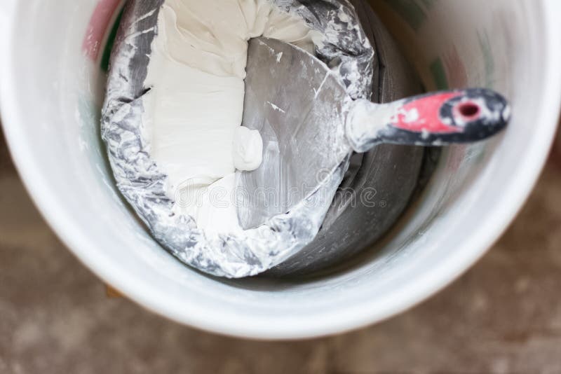 Spatula with Bucket of Glue,ready-made Solution of Glue in a Bucket ...