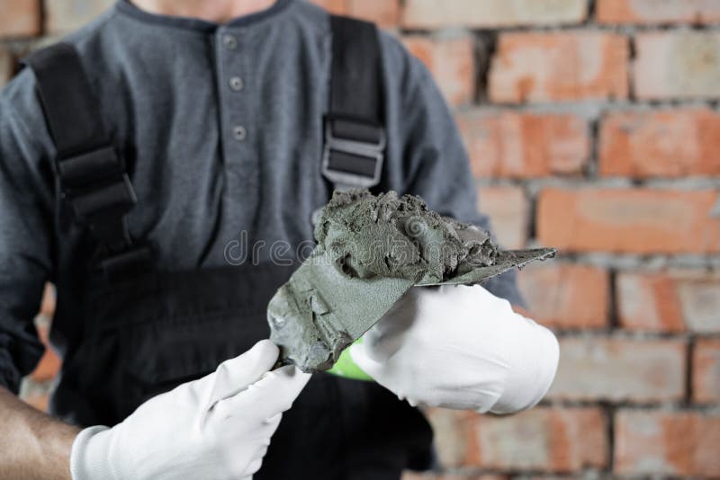 Two Hands, Two Trowels! stock photo. Image of trowel, slab - 583660