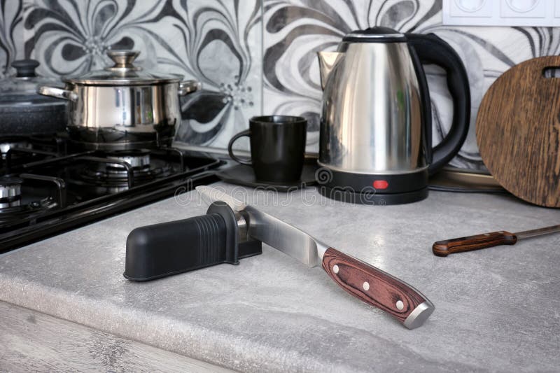 Close-up of a Special Device for Sharpening Knives and a Large Kitchen ...