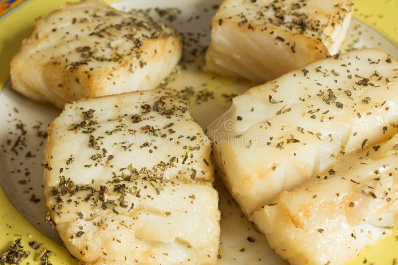 Close-up of Species on Cooked Cod Loins on a Decorative Plate. Stock ...