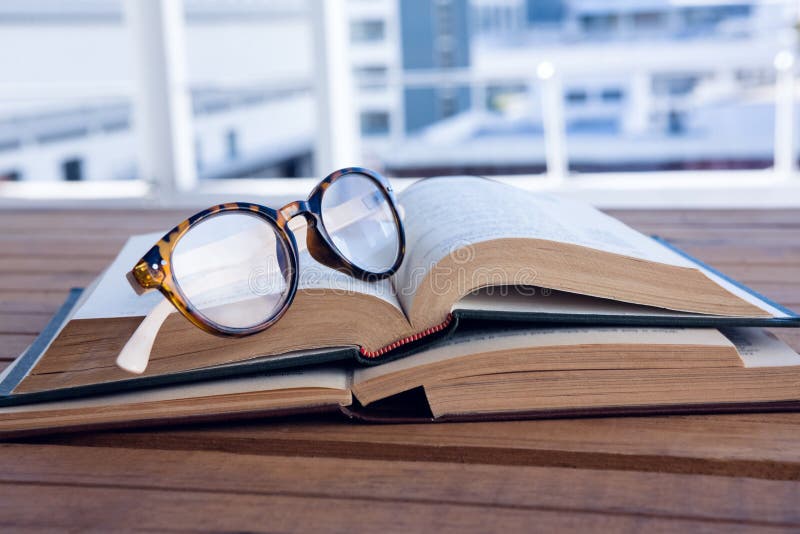 Close-up of Spectacles on Open Book Stock Image - Image of spectacles ...