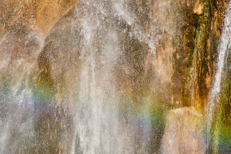Waterfall with Motion Blur Next To Old Stone Houses on a Slope with Big ...