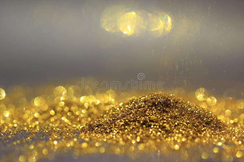 Close Up of Sprinkle Gold Dust and Glitter Lights on Dark Background ...