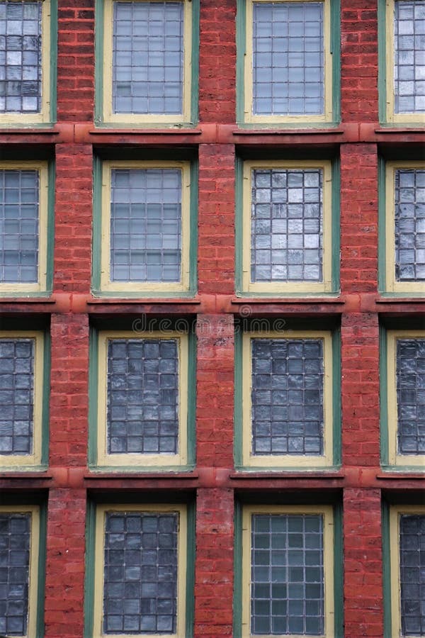 Close Up of Square Glass Windows in Red Brickface Building Stock Photo ...