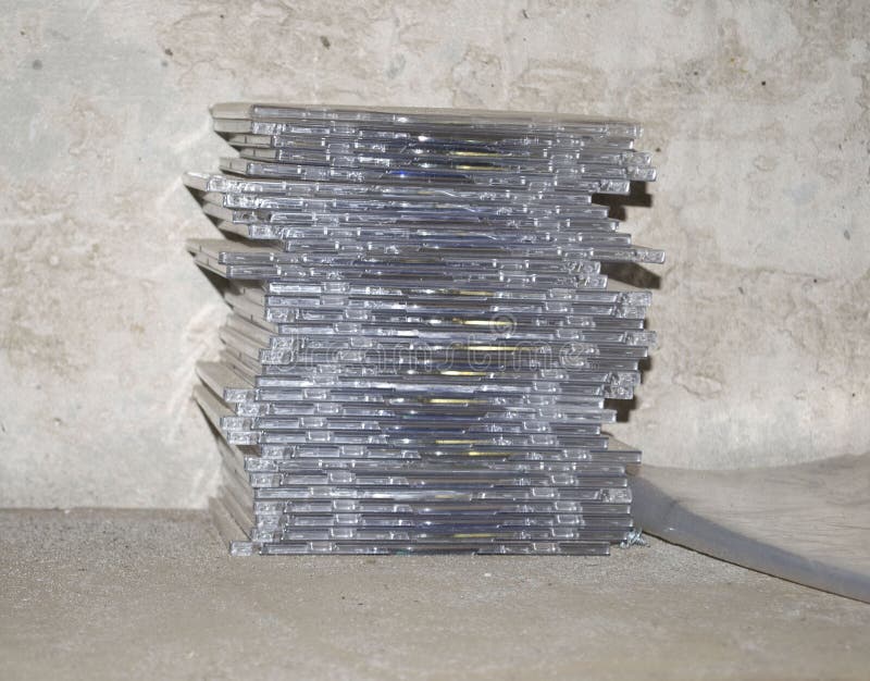 Close-up Stack of Compact Discs on Plywood and Concrete Wall Stock ...