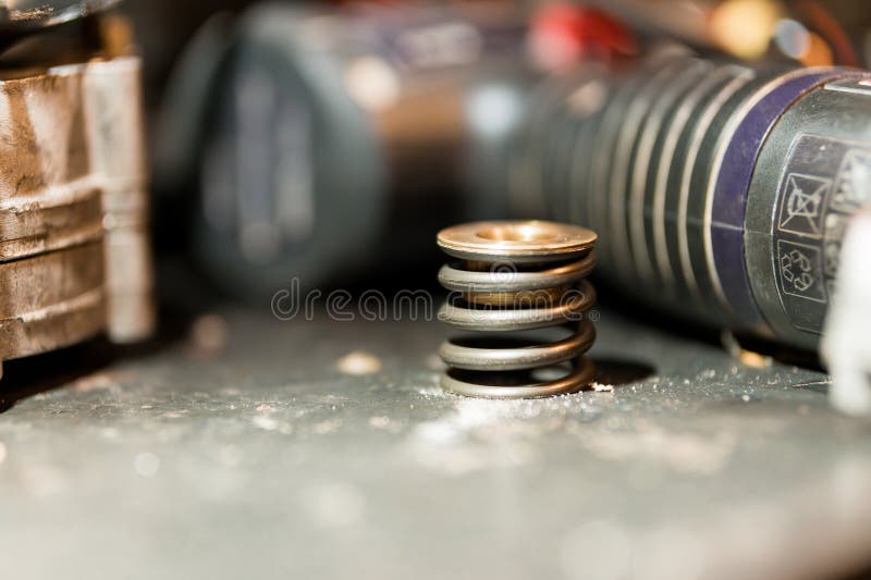 Close-up of a Stack of Compression Springs on a Workbench Surrounded by ...