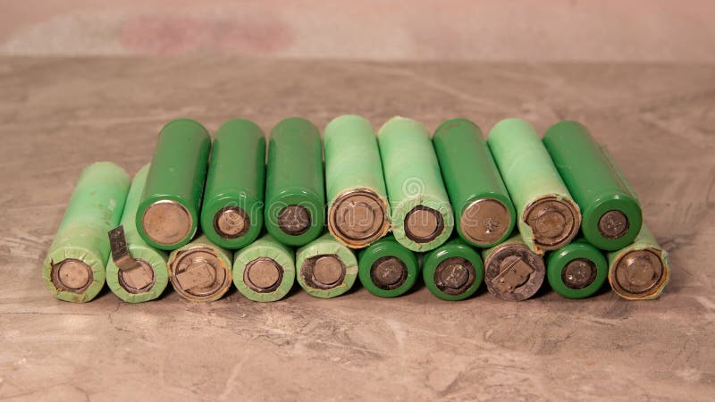 Close-up of a Stack of Green Lithium-ion Batteries Arranged on a ...