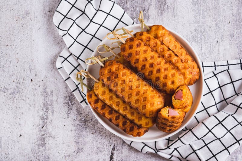 Close Up of Stack of Homemade Corn Dogs with Sausage on a Plate on a ...