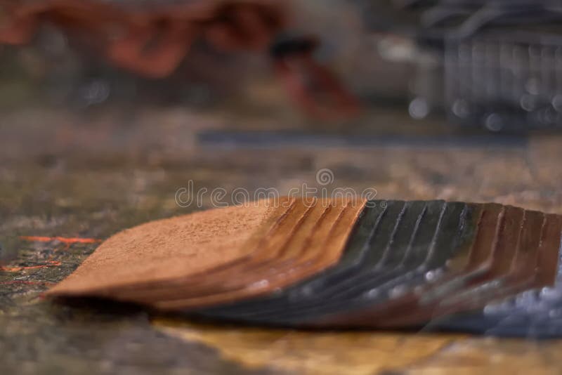 Stack of Leather Pieces on the Workbench. Leathercraft Stock Photo ...