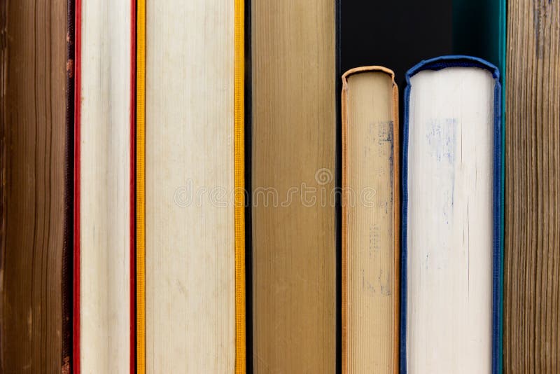 Close Up Stack of Old Books Vertically Placed on the Wooden Shelf Stock ...