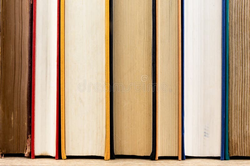Close Up Stack of Old Books Vertically Placed on the Wooden Shelf Stock ...